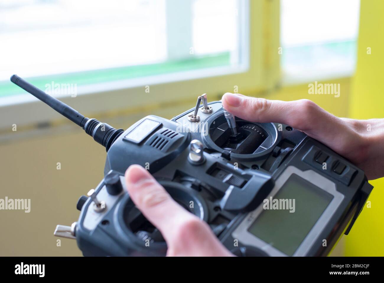 Photo of large radio remote control in the boy's hand Stock Photo - Alamy
