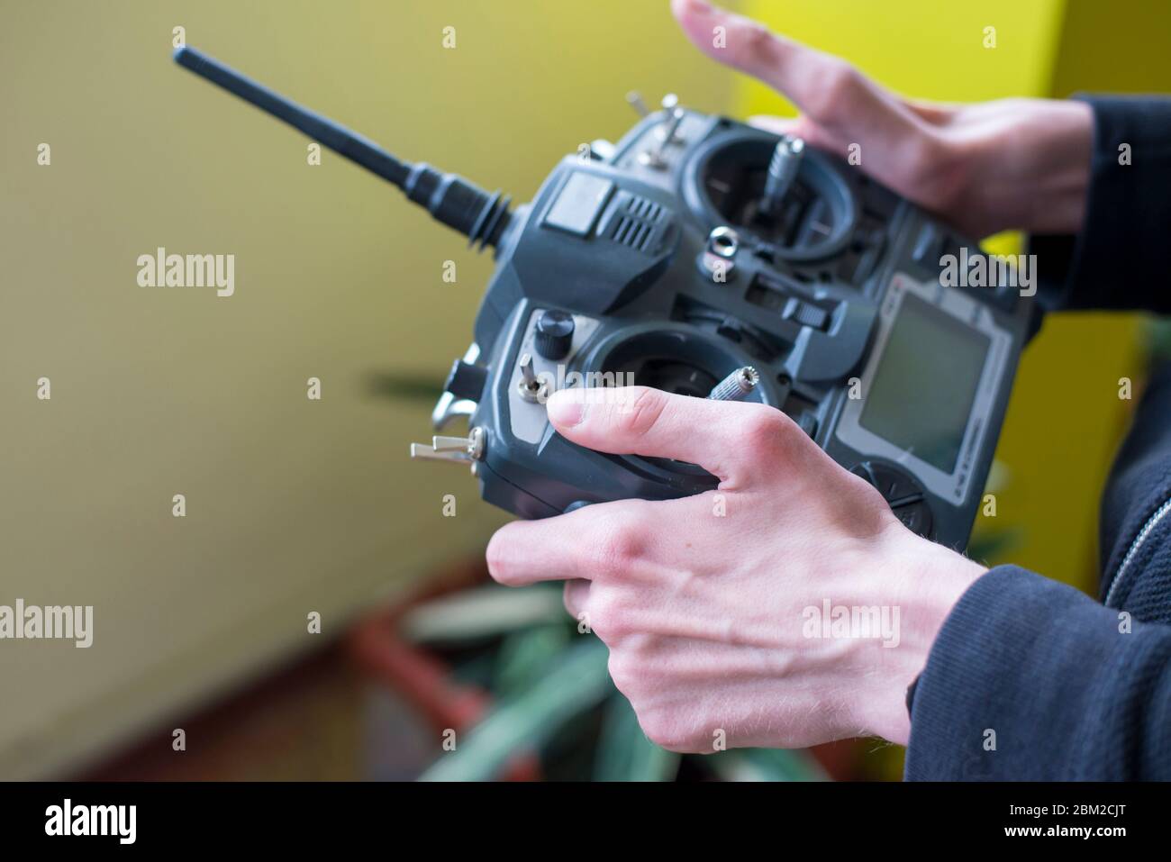 Photo of large radio remote control in the boy's hand Stock Photo - Alamy