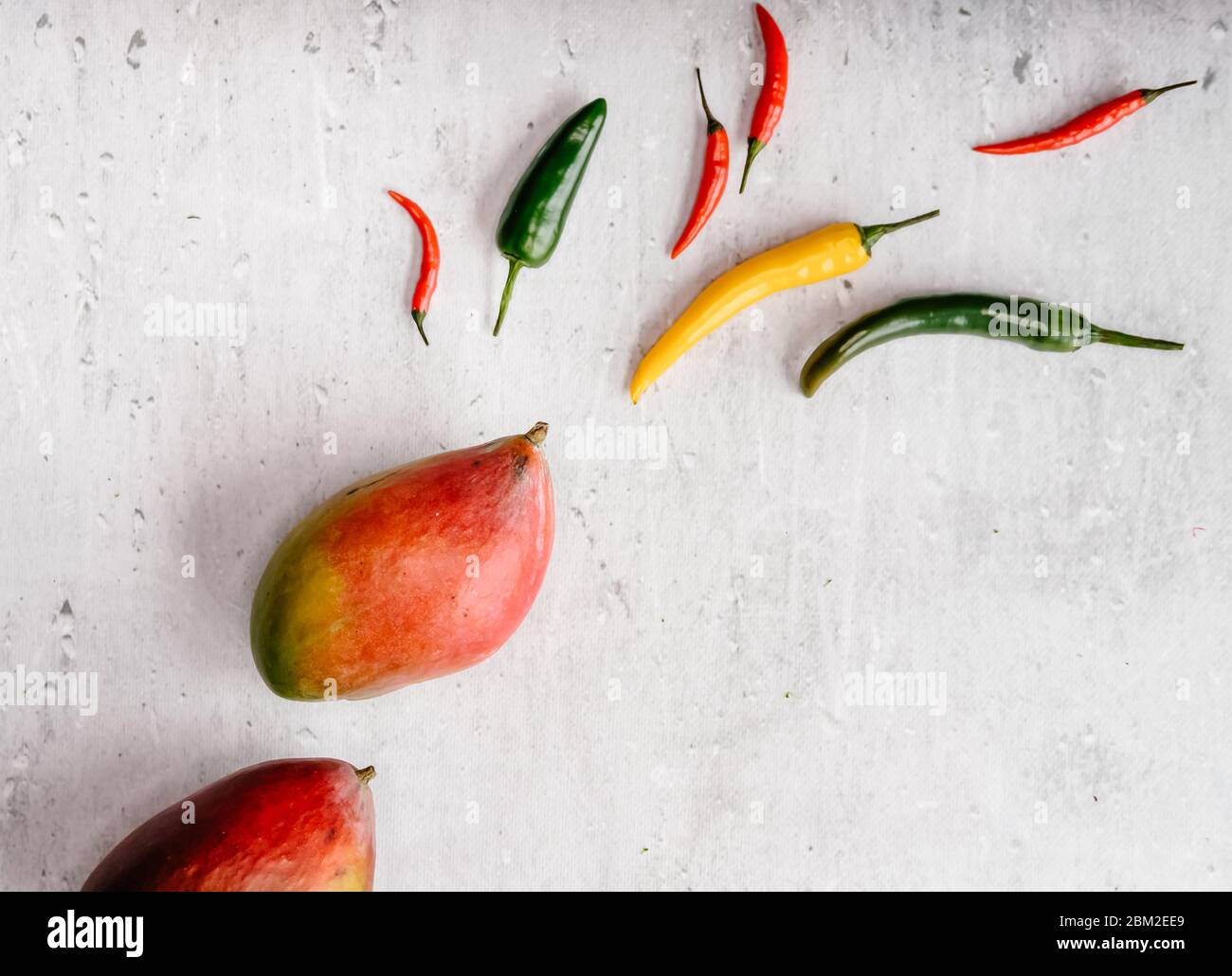 Hot peppers and mango Stock Photo - Alamy