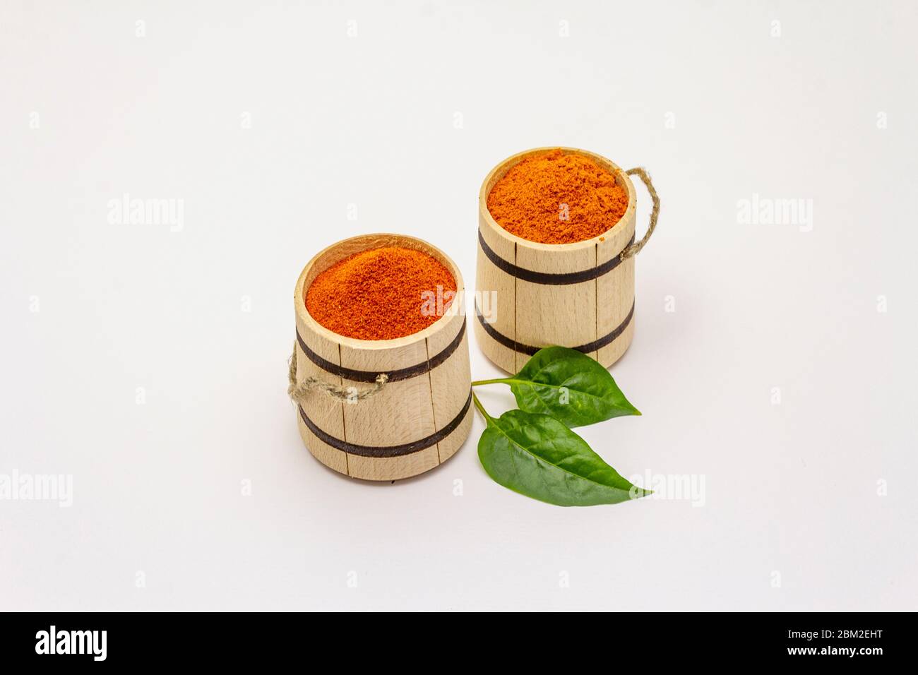 Two types of Hungarian paprika powder, hot and sweet, isolated on white ...