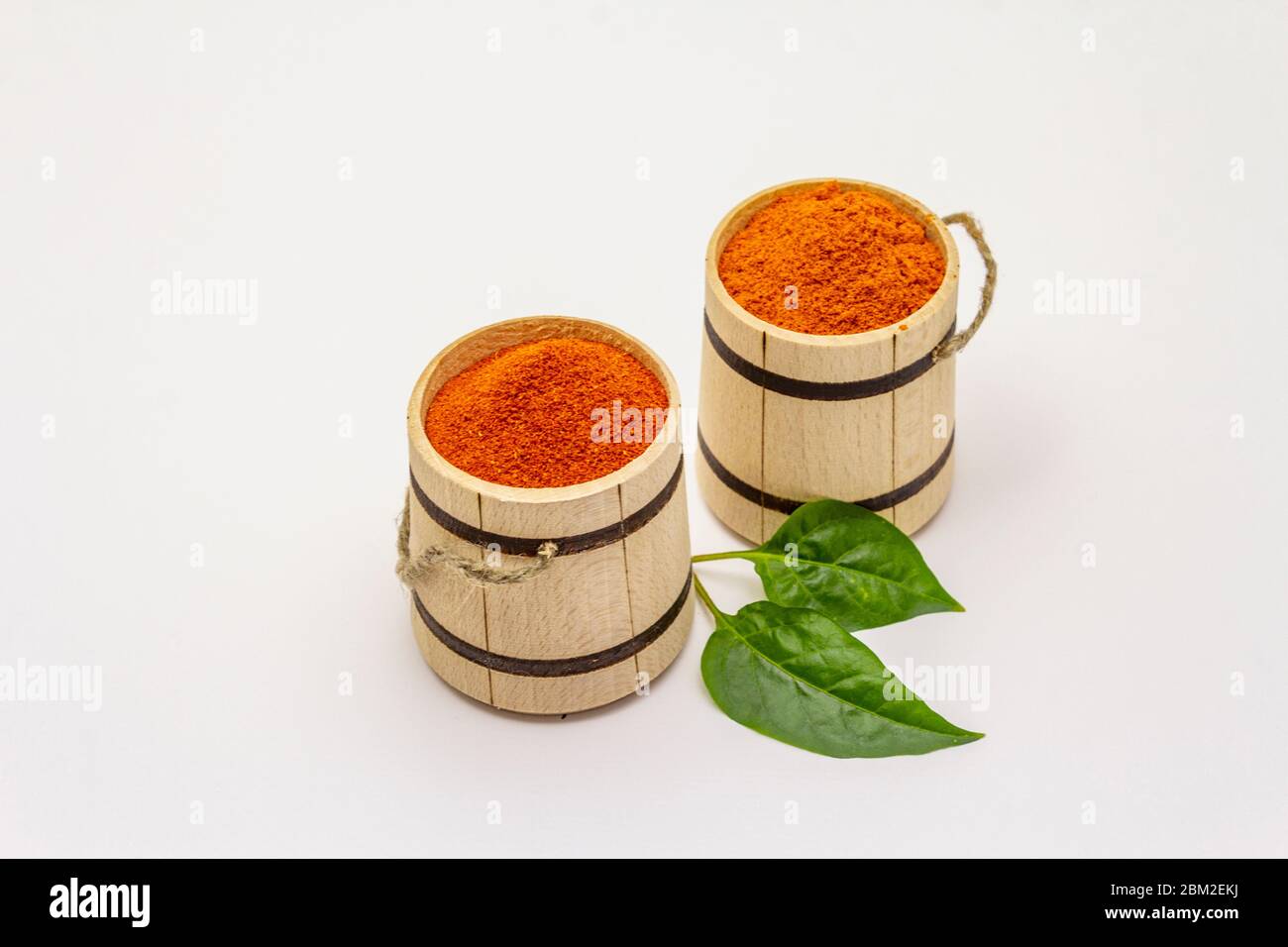 Two types of Hungarian paprika powder, hot and sweet, isolated on white ...