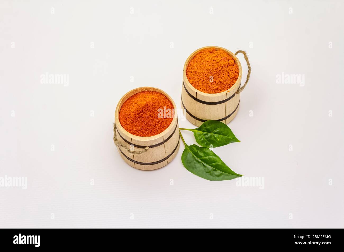 Two types of Hungarian paprika powder, hot and sweet, isolated on white ...