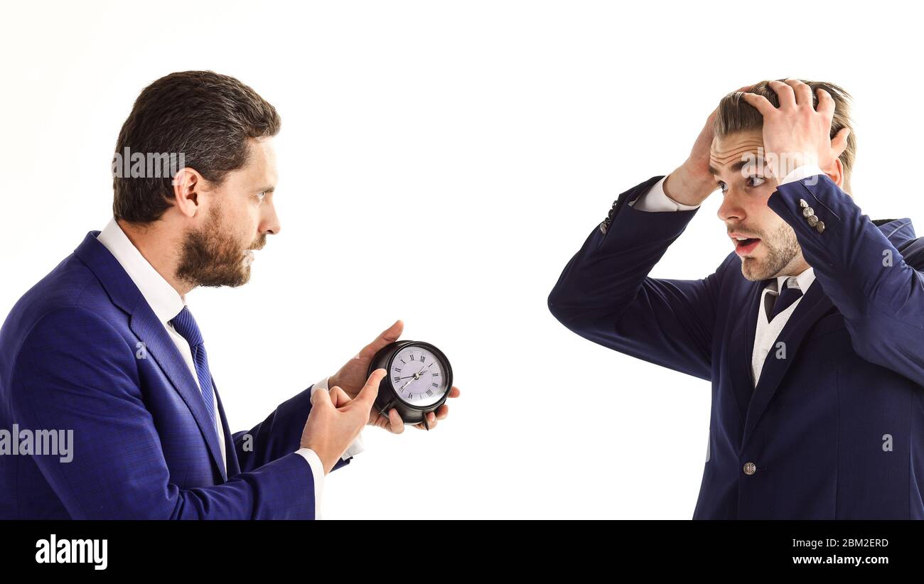 Boss with serious face caught latecomer on white background ...