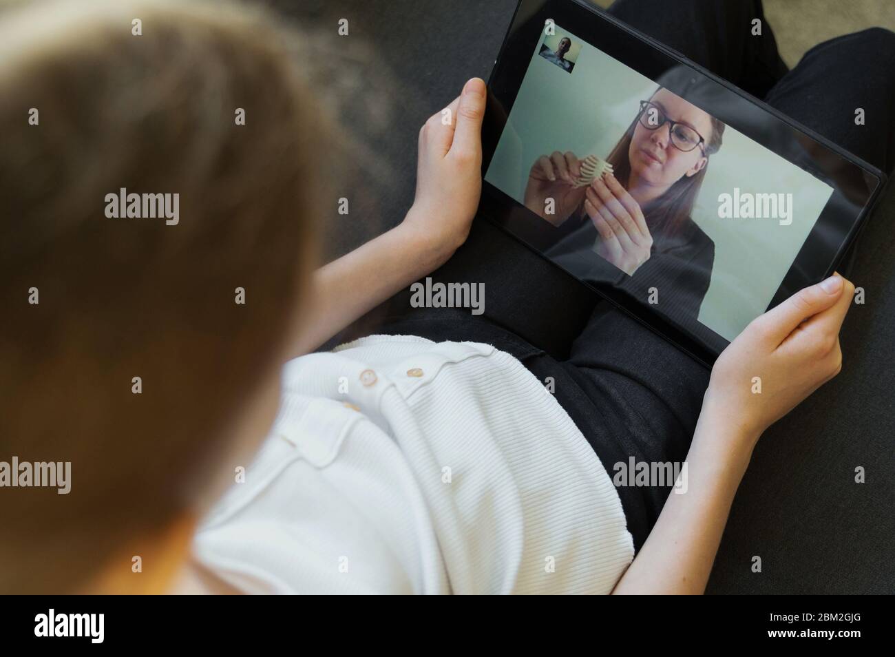 Little girl making video call with school teacher. Distance learning ...