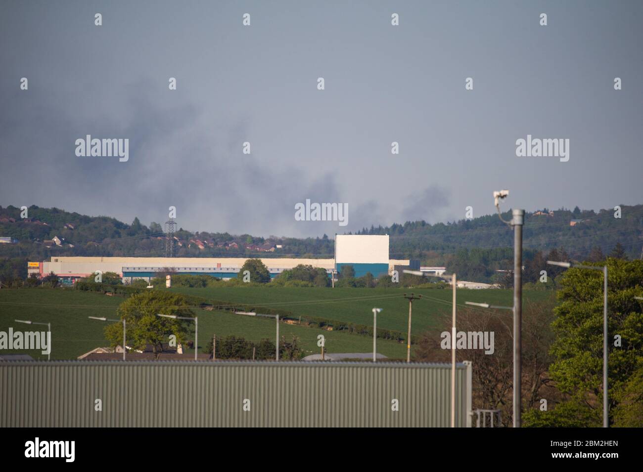 Stepps, Glasgow, UK. 6th May, 2020. Pictured: Smoke forms a blanket ...