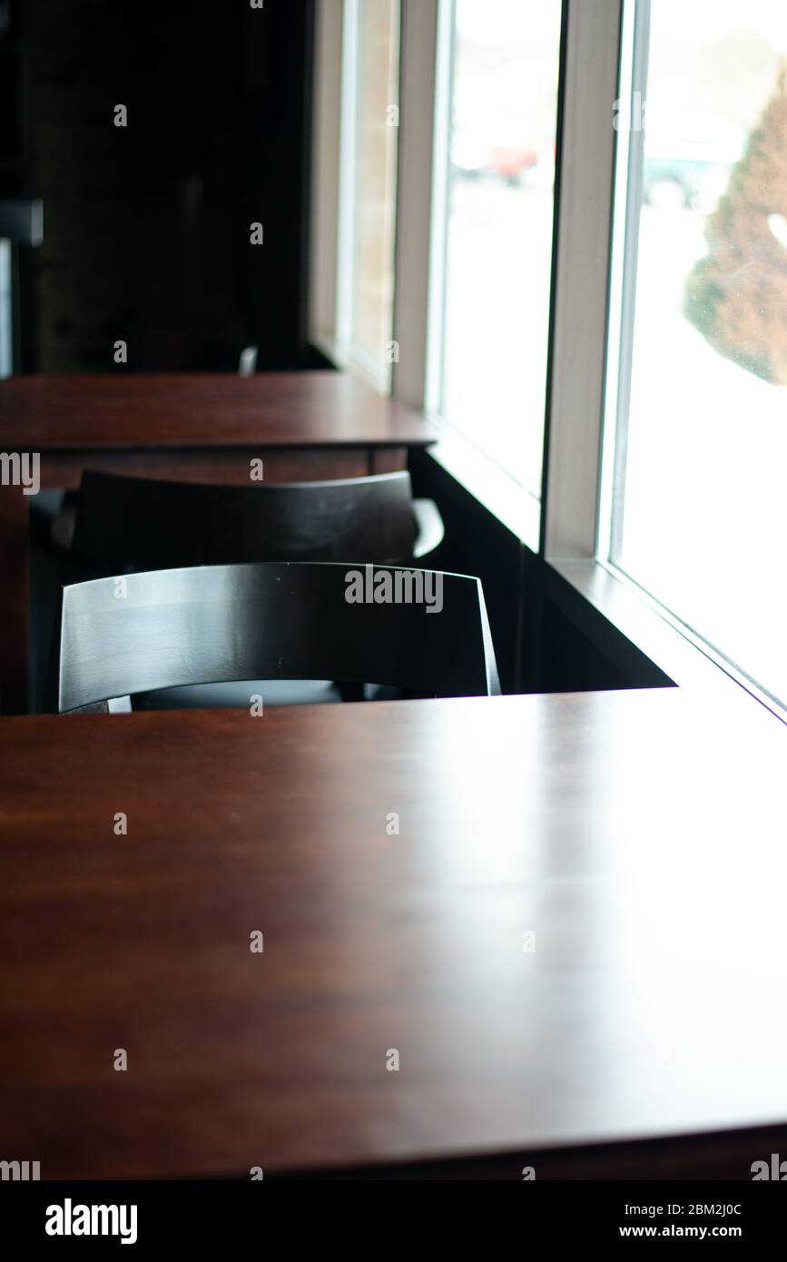 A kitchen with a table in front of a window Stock Photo - Alamy