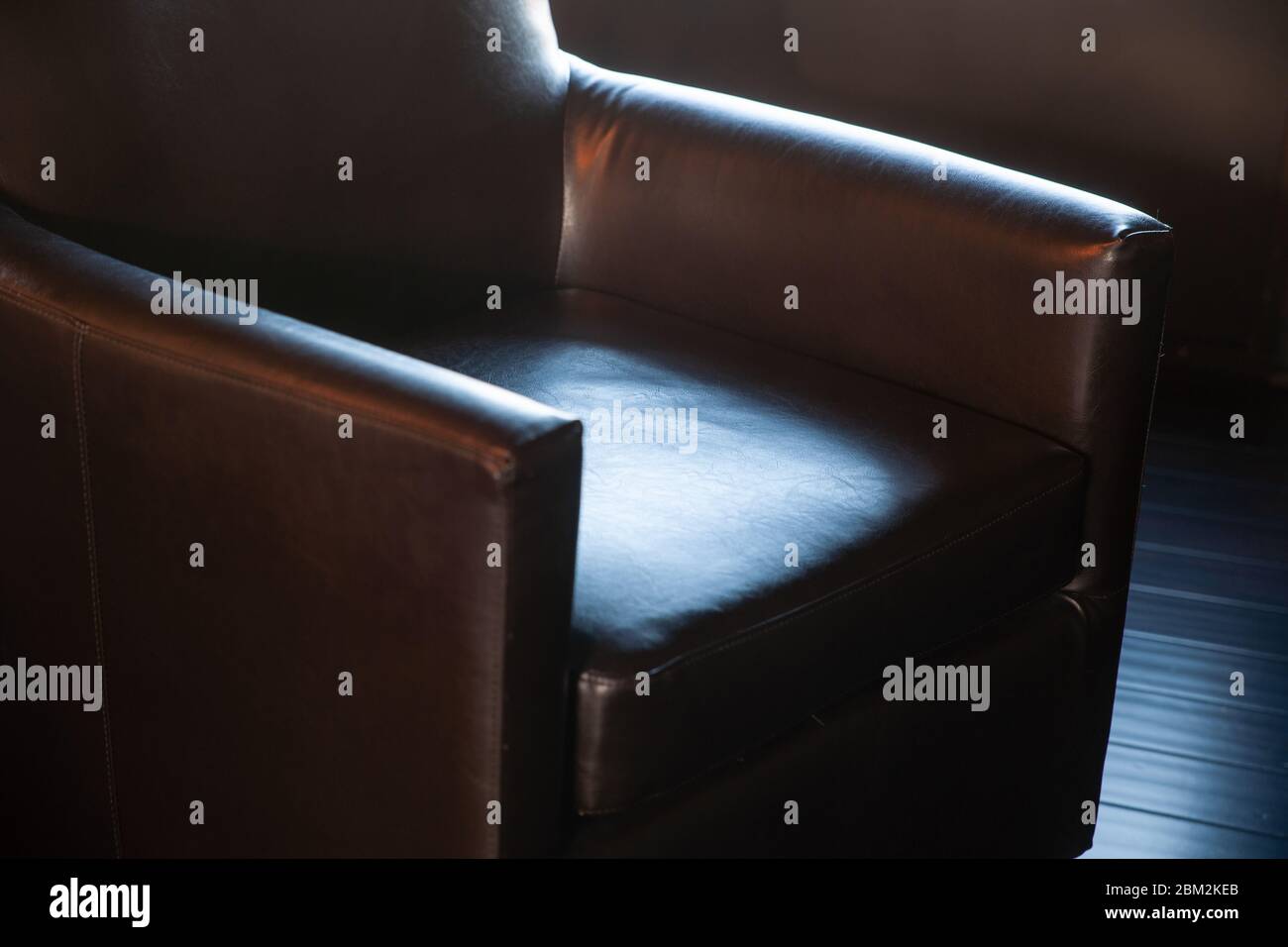 Dramatic dark lighting on comfortable office chair Stock Photo - Alamy