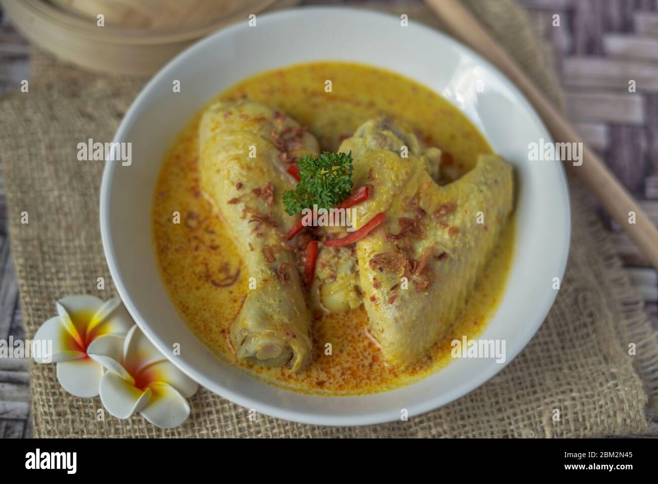 Opor Ayam (Indonesian Curry), Chicken cooked in coconut milk and spices ...