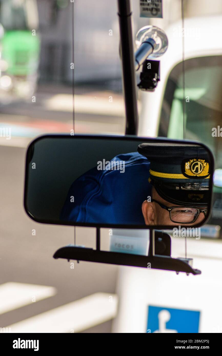Hiroshima / Japan - December 20, 2017: Bus driver taking a look in the ...