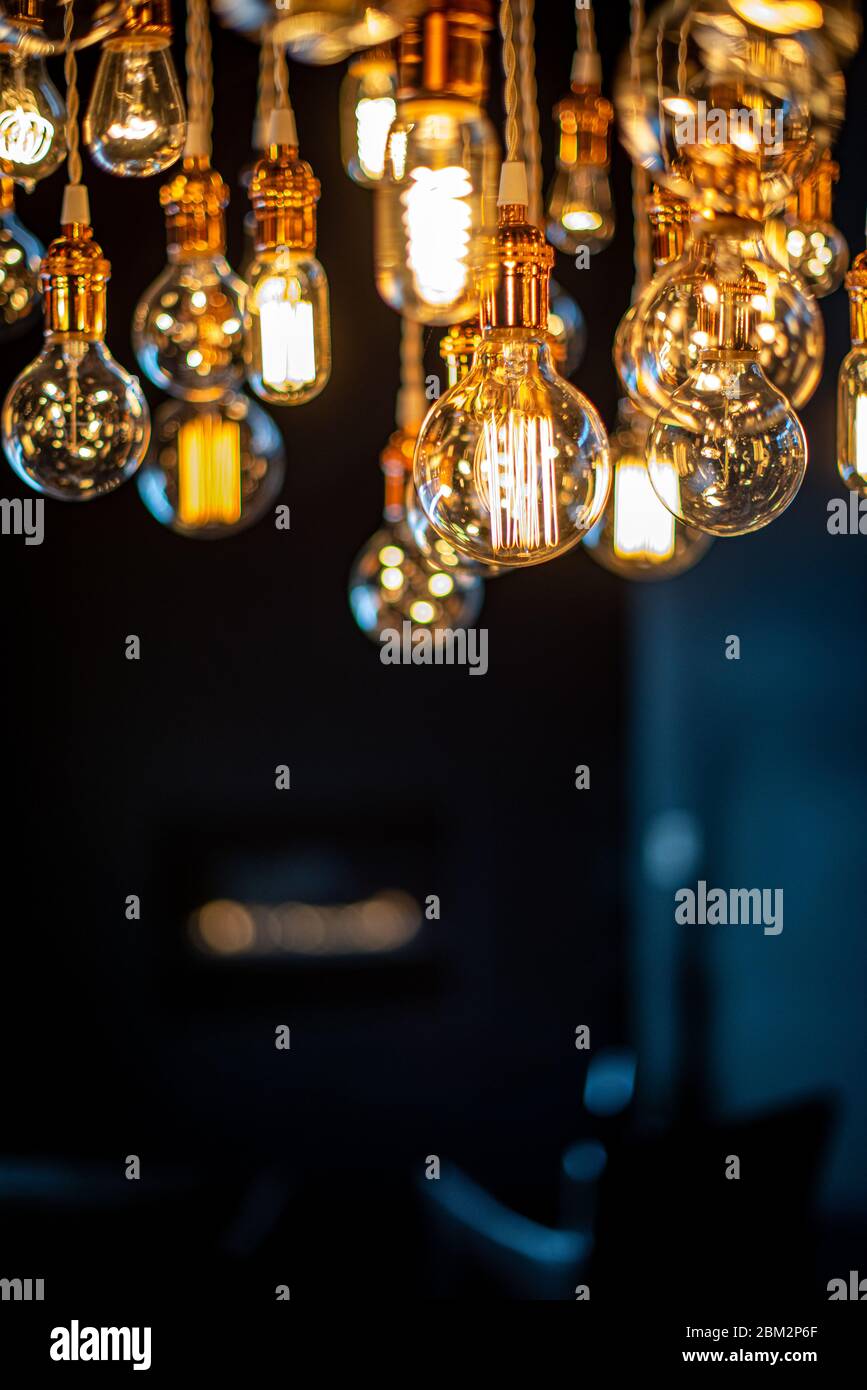 Hanging array of many incandescent light bulbs Stock Photo - Alamy