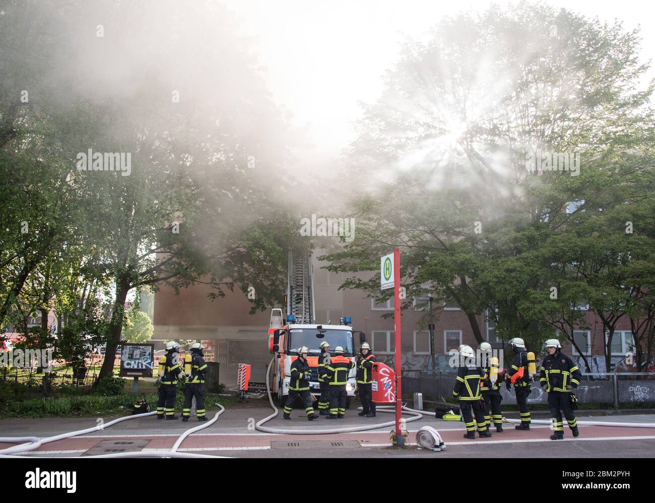 Hamburg, Germany. 06th May, 2020. Firefighters extinguish a fire in an ...