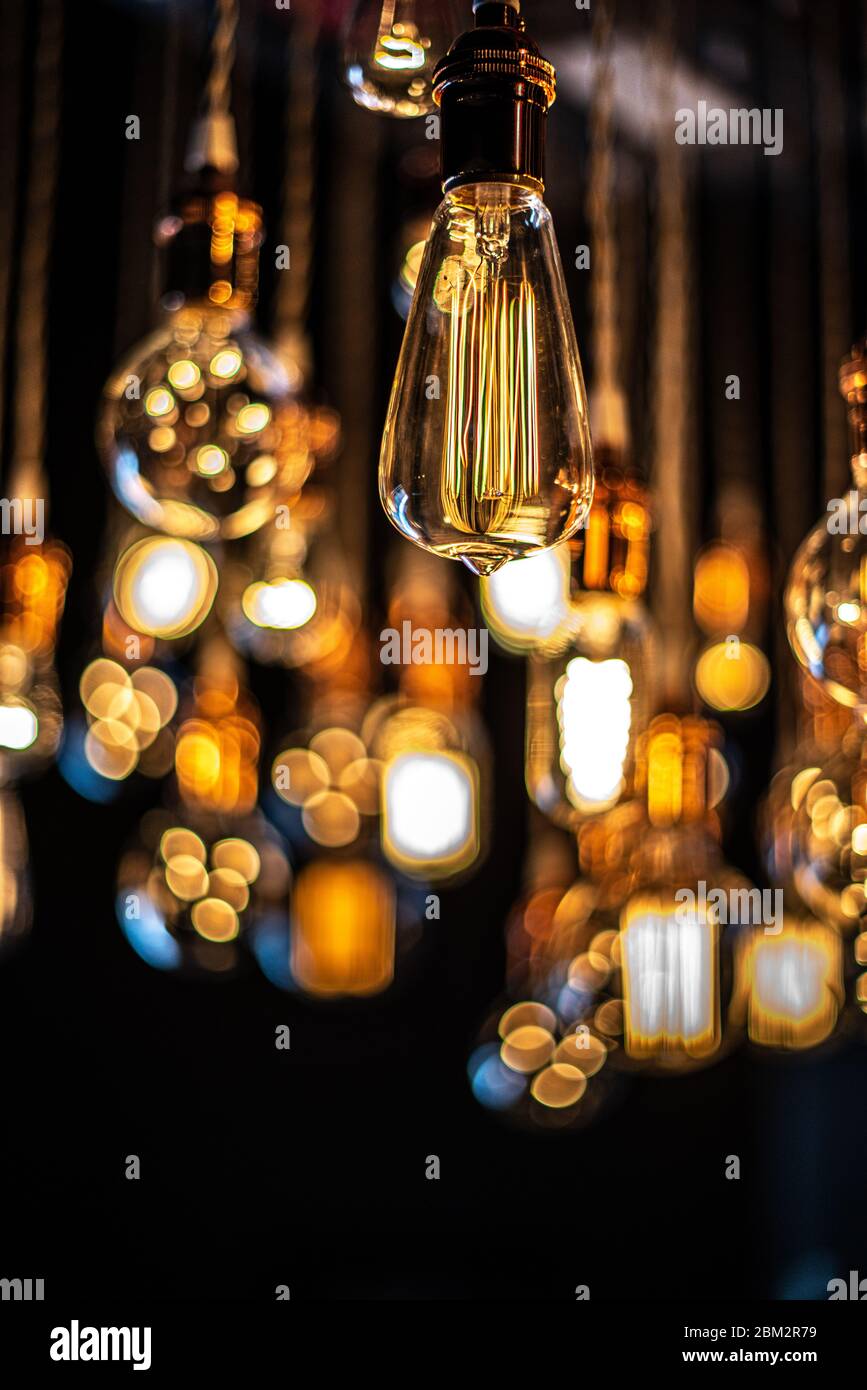 Hanging array of many incandescent light bulbs Stock Photo - Alamy