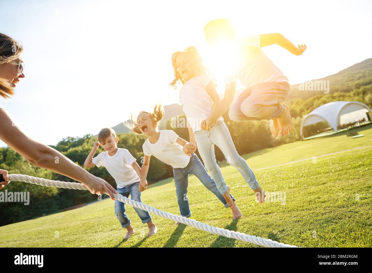 Children have fun playing in nature Stock Photo - Alamy