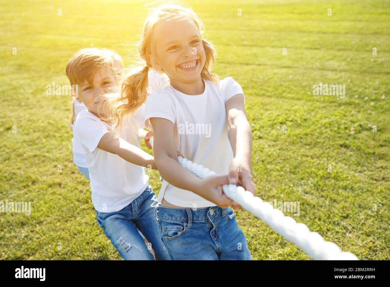 Children have fun playing in nature Stock Photo - Alamy
