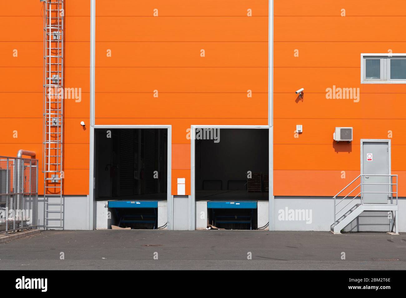 Cargo Doors at Orange Distribution Warehouse Stock Photo - Alamy