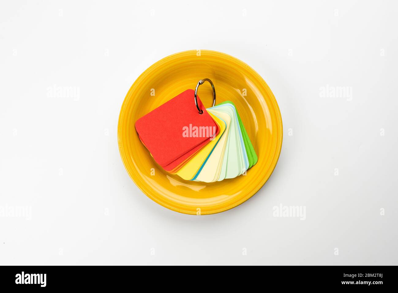 Yellow plate with a color palette Stock Photo - Alamy