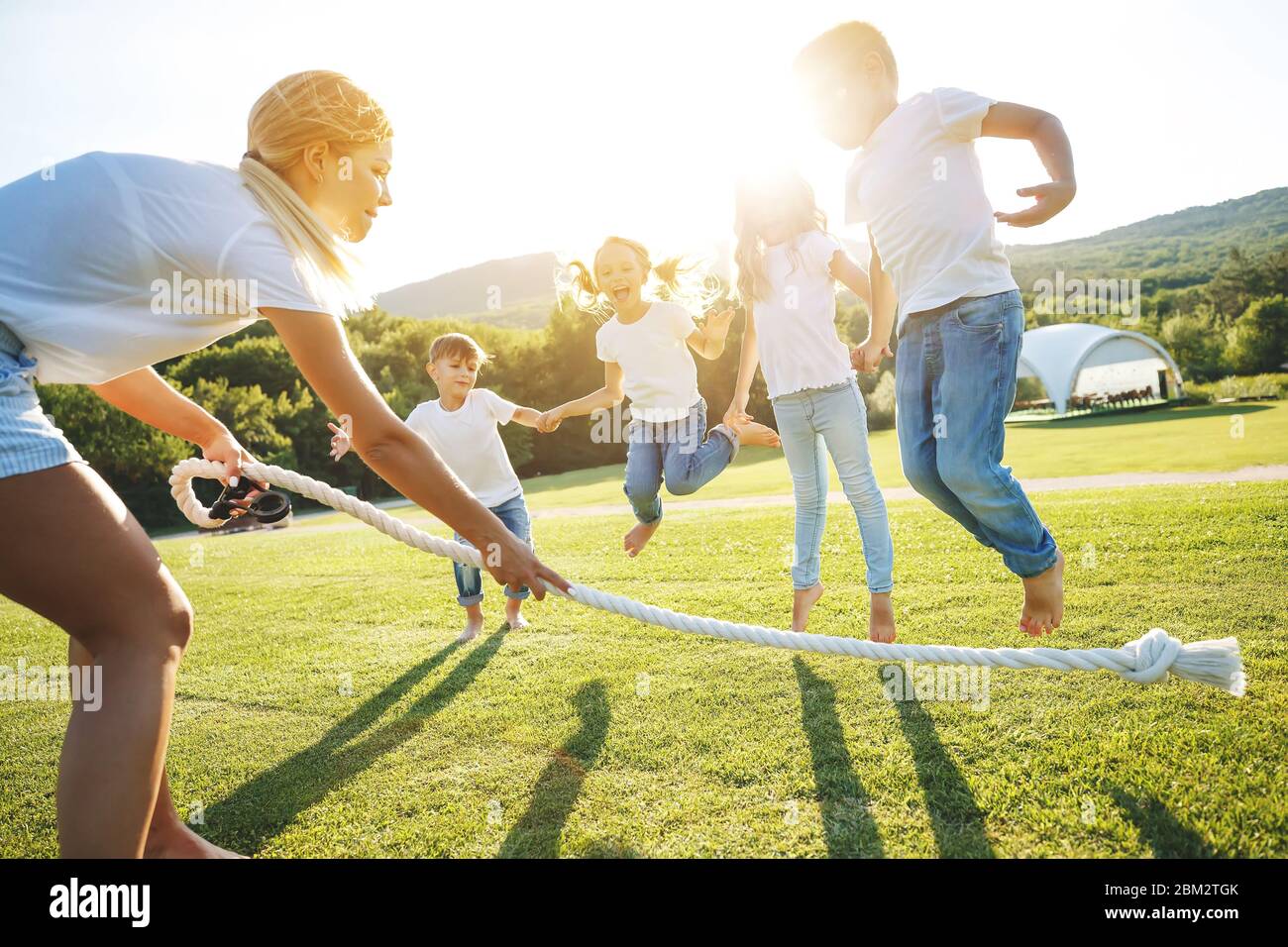 Children have fun playing in nature Stock Photo - Alamy