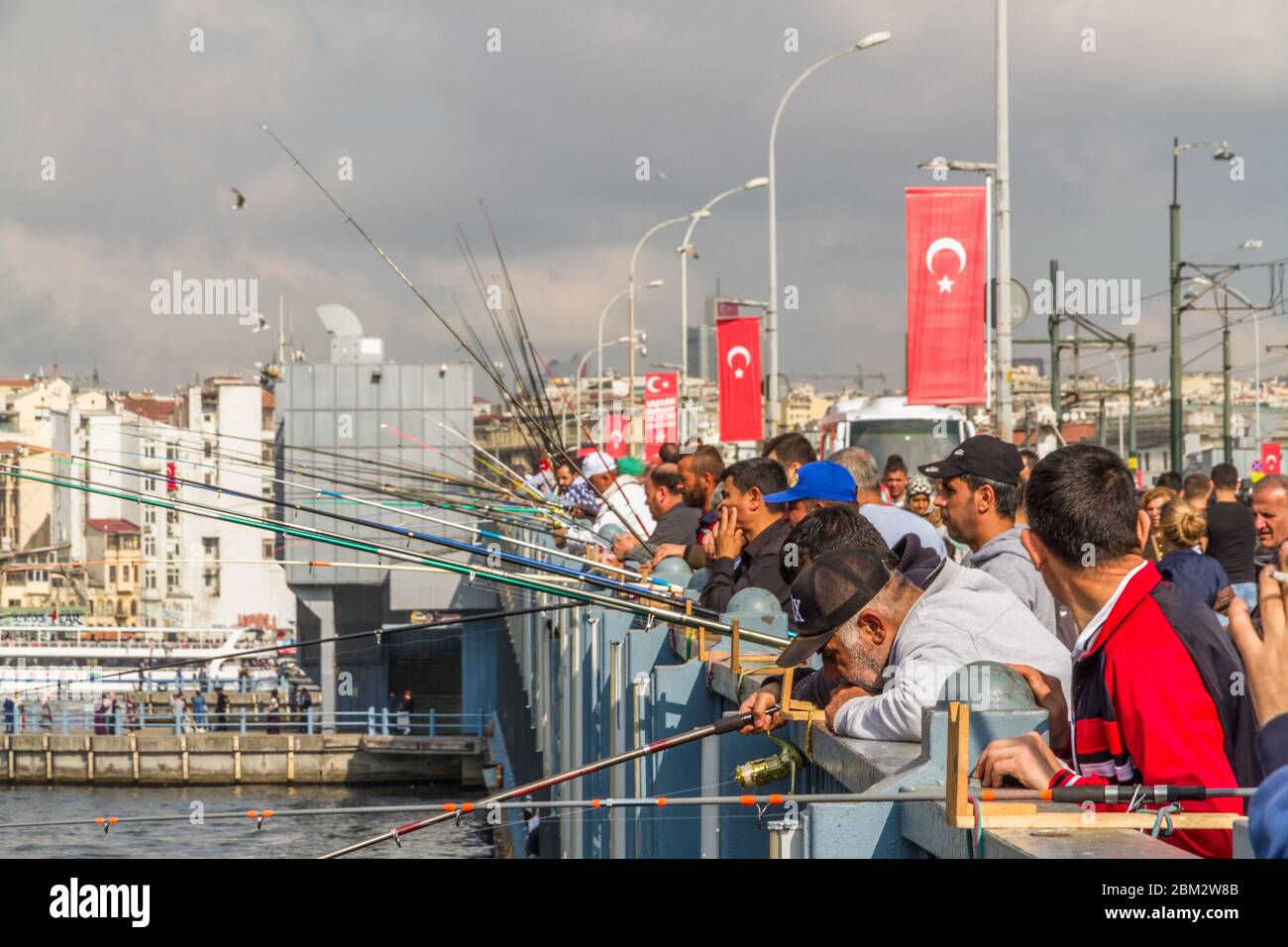 Istanbul, Turkey – Men fishing in Golden Horn Bosphorus from the Galata ...