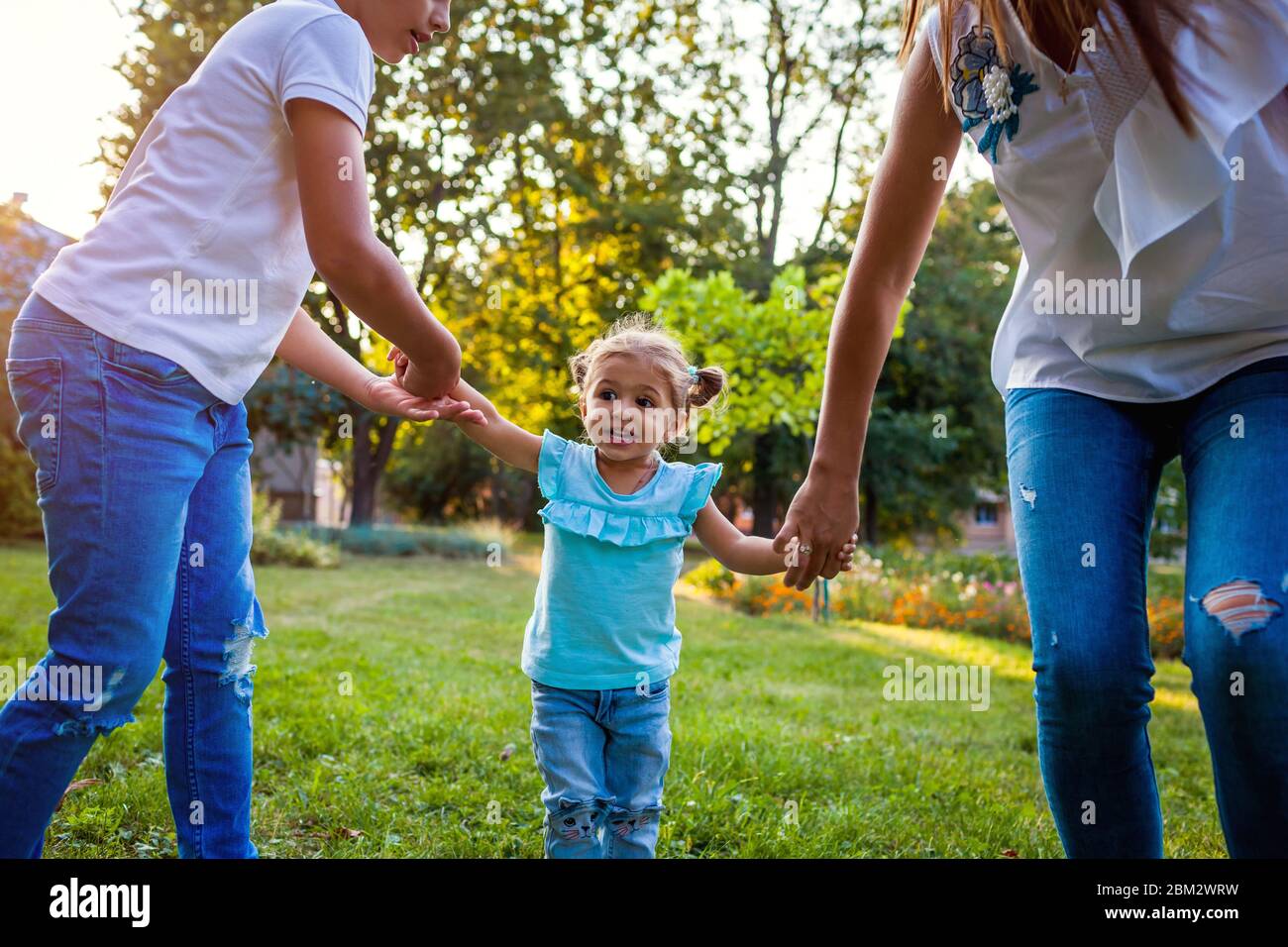 Two kids walking hi-res stock photography and images - Alamy