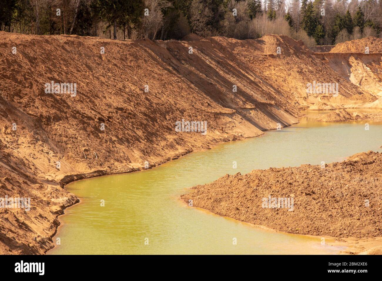 Sand deep quarry and reservoir illuminated by the sun Stock Photo - Alamy