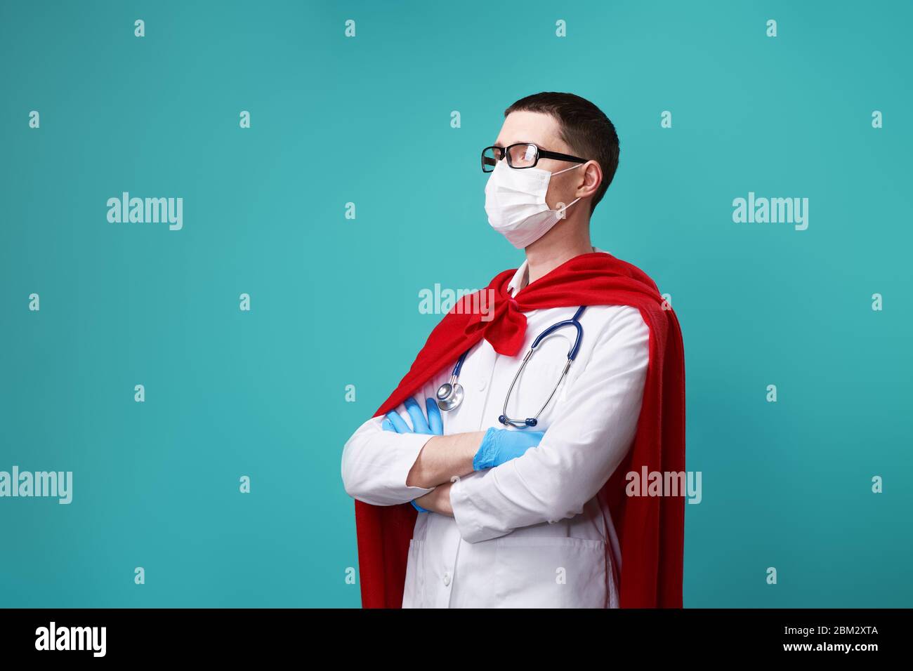 Doctor wearing surgical face mask in superhero cape. Concept of super ...