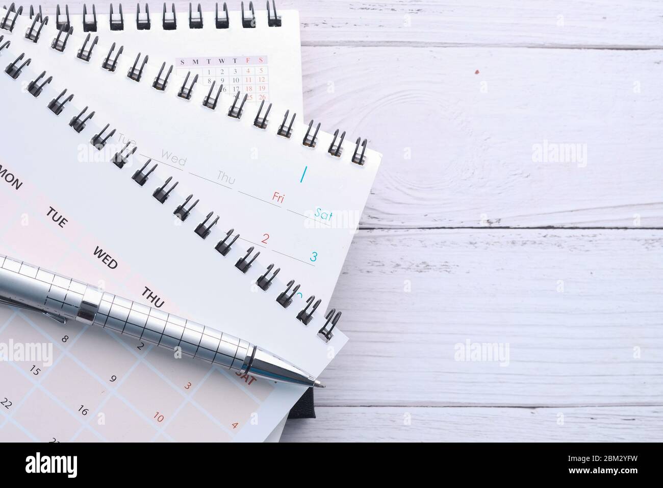 stack of calendar and pen on office desk Stock Photo - Alamy