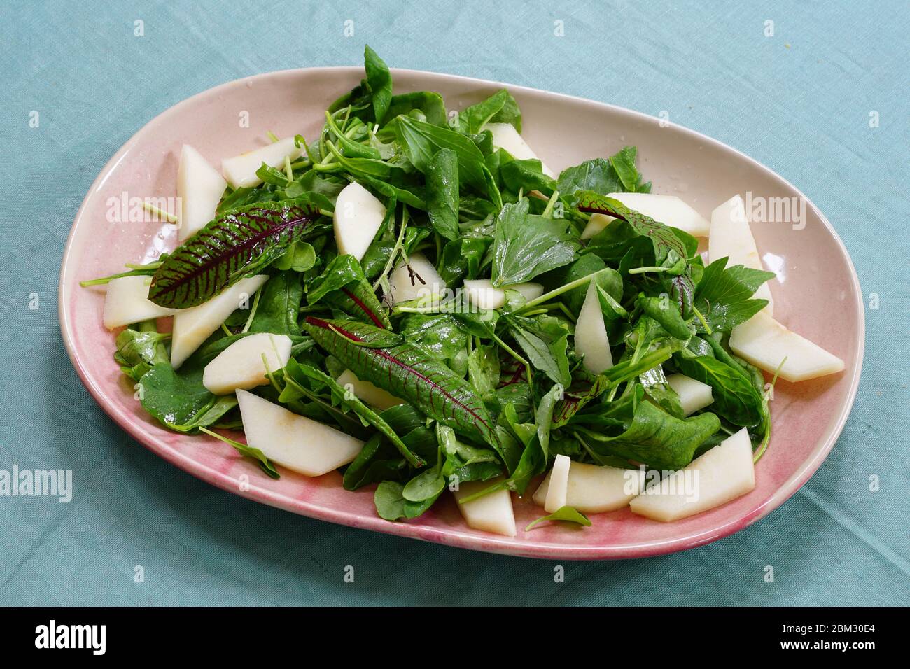 Mixed pear and green salad including leaves of blood dock red sorrel ...