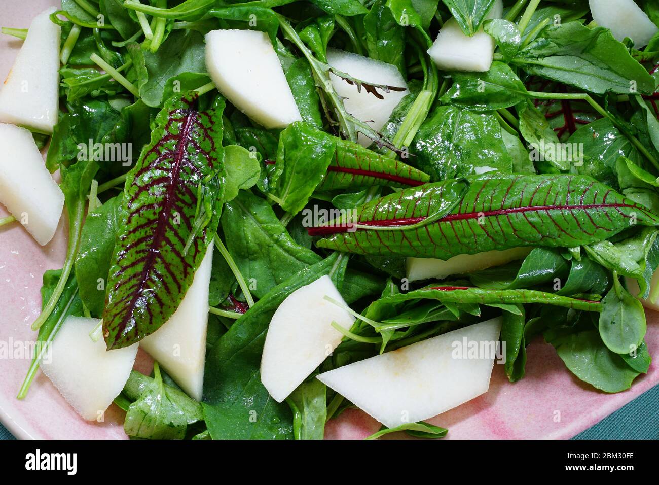 Mixed pear and green salad including leaves of blood dock red sorrel ...