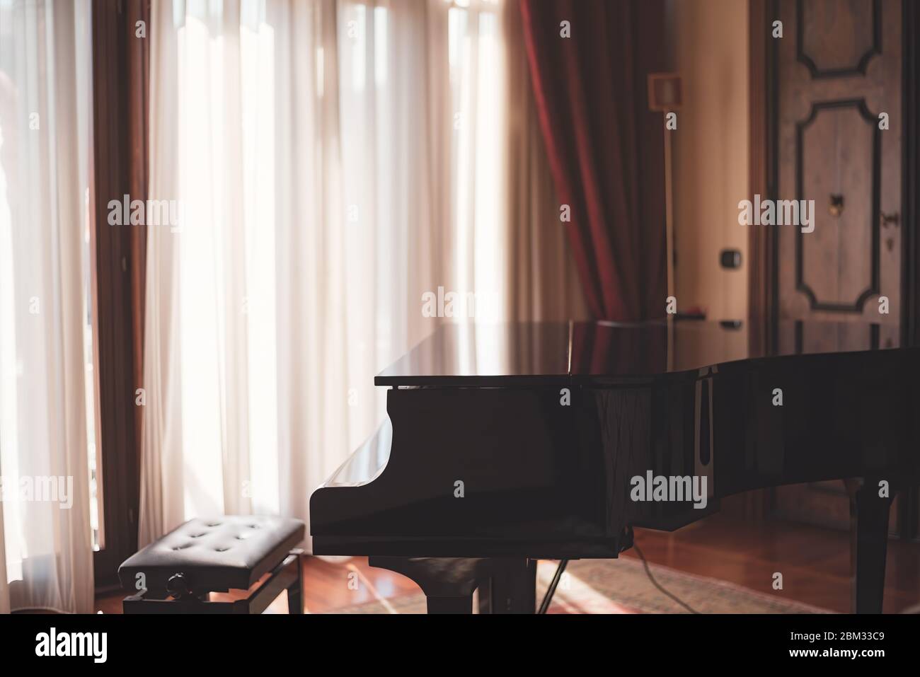 Art scene of a grand piano and beautiful sunlight radiating through the ...