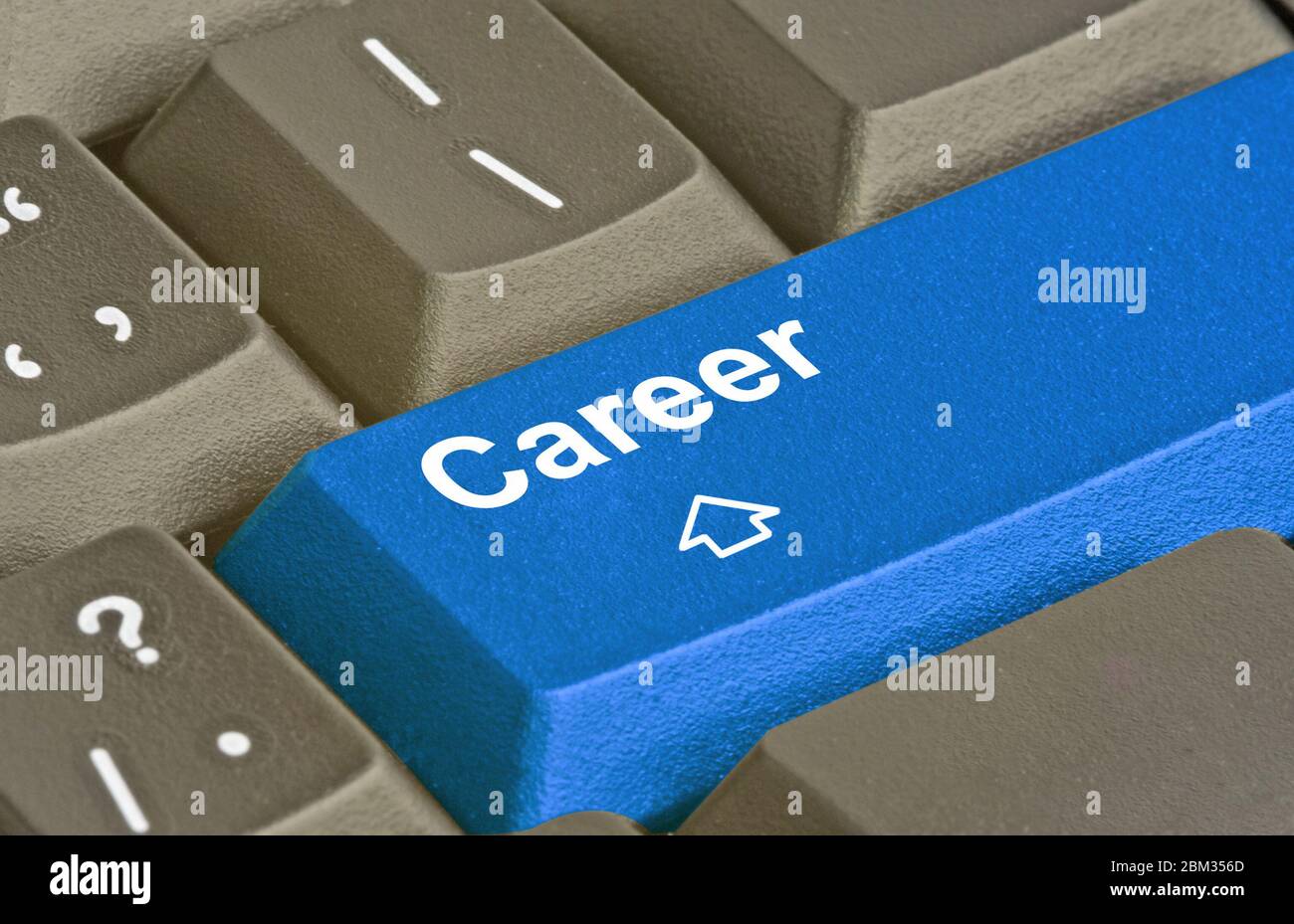 Keyboard with key for career success Stock Photo - Alamy
