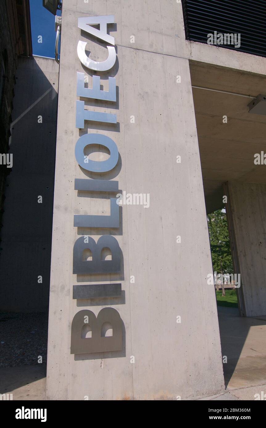 Vertical biblioteca inscription sign in Italian language on concrete ...