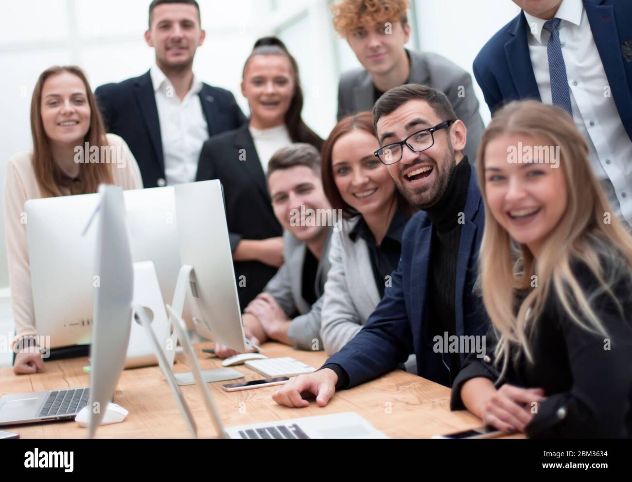 large group of employees in the workplace in the office Stock Photo - Alamy