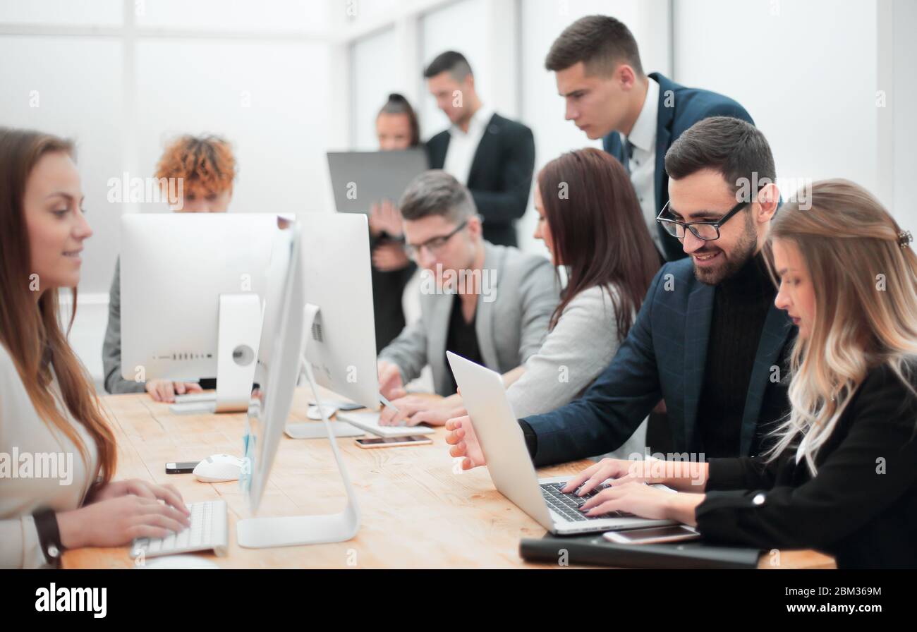 professional employees work on computers in a modern office Stock Photo ...