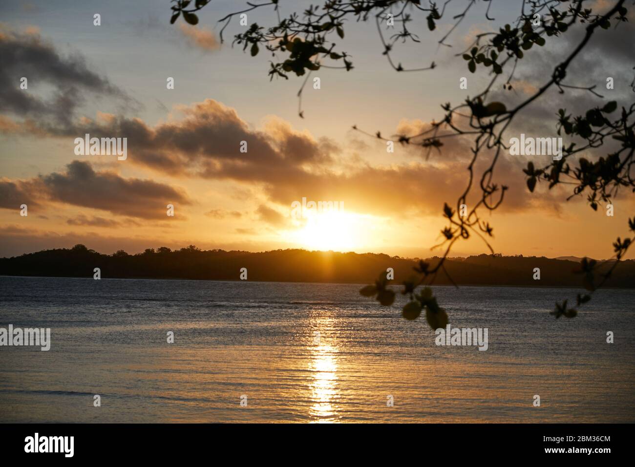 A beautiful sunrise over the ocean captured from a remote island in ...