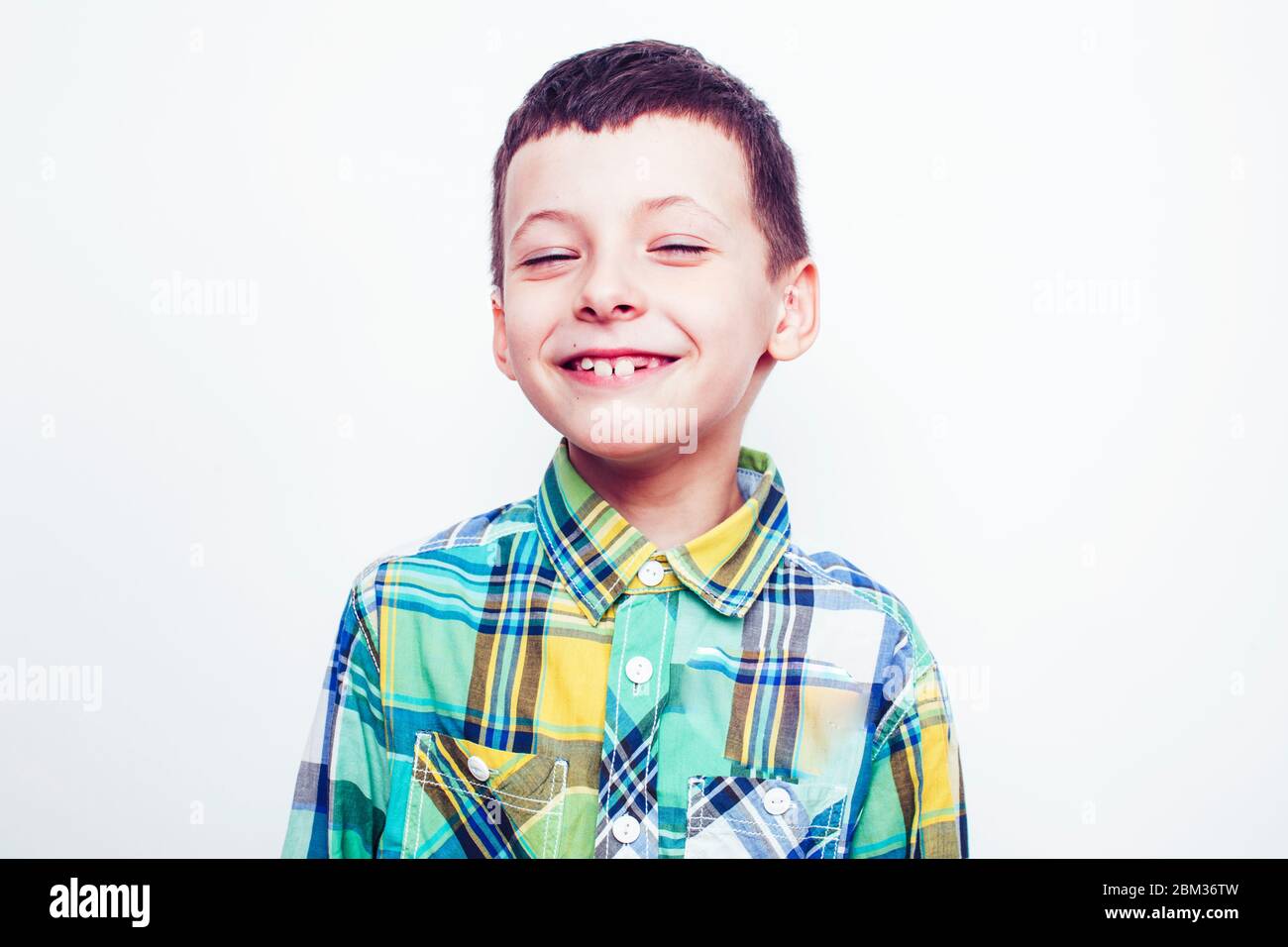 little cute real boy on white background gesture smiling close up ...