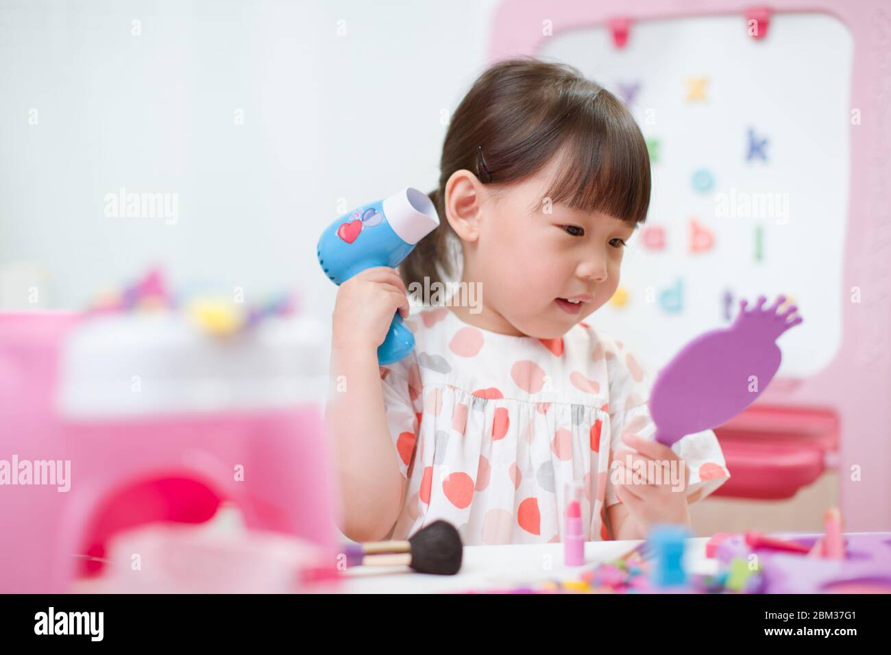 toddler girl pretend play make up at home Stock Photo - Alamy