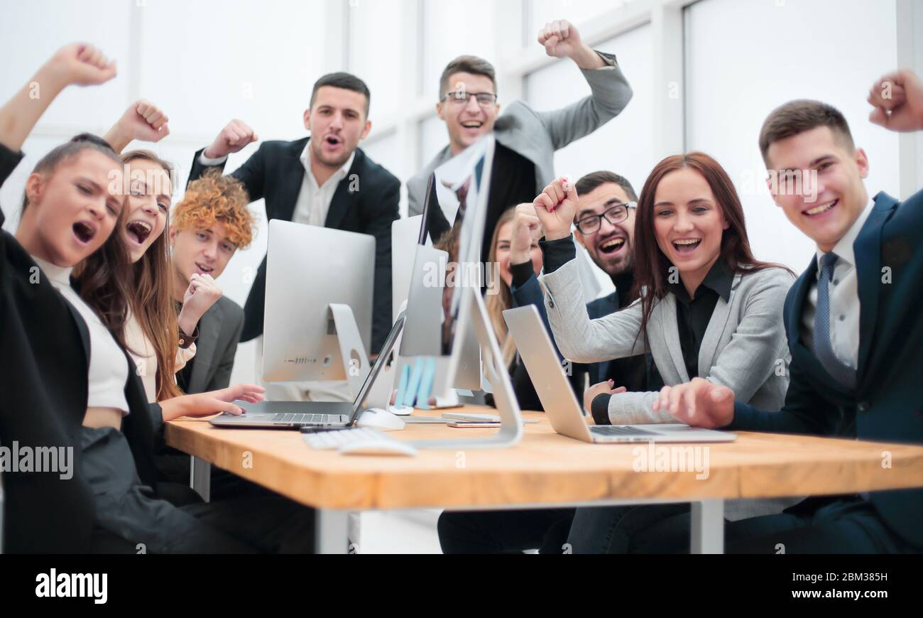 Happy employees sitting table hi-res stock photography and images - Alamy