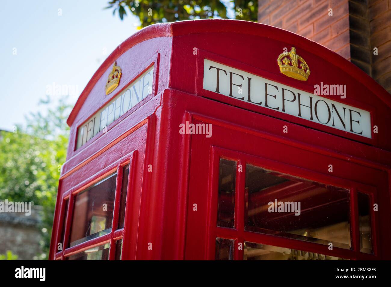 Red phone booth in the daytime Stock Photo - Alamy