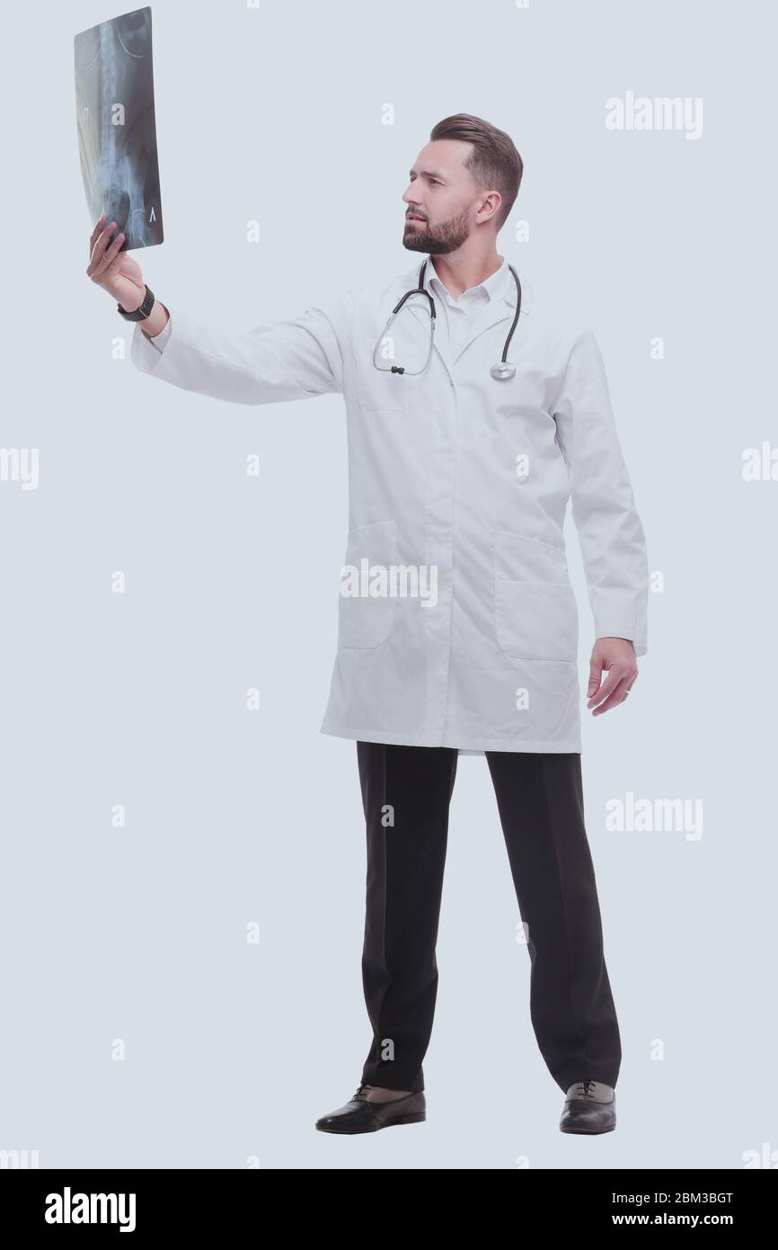 in full growth. medical doctor looking closely at the x-ray Stock Photo ...