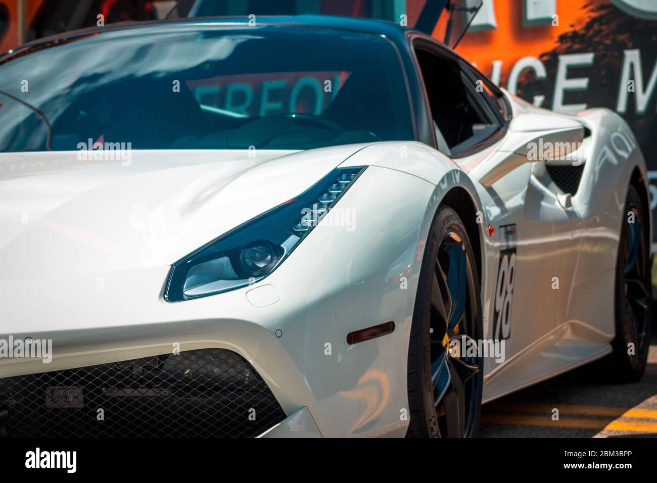 White car on display at a car show waiting for a drag race Stock Photo ...