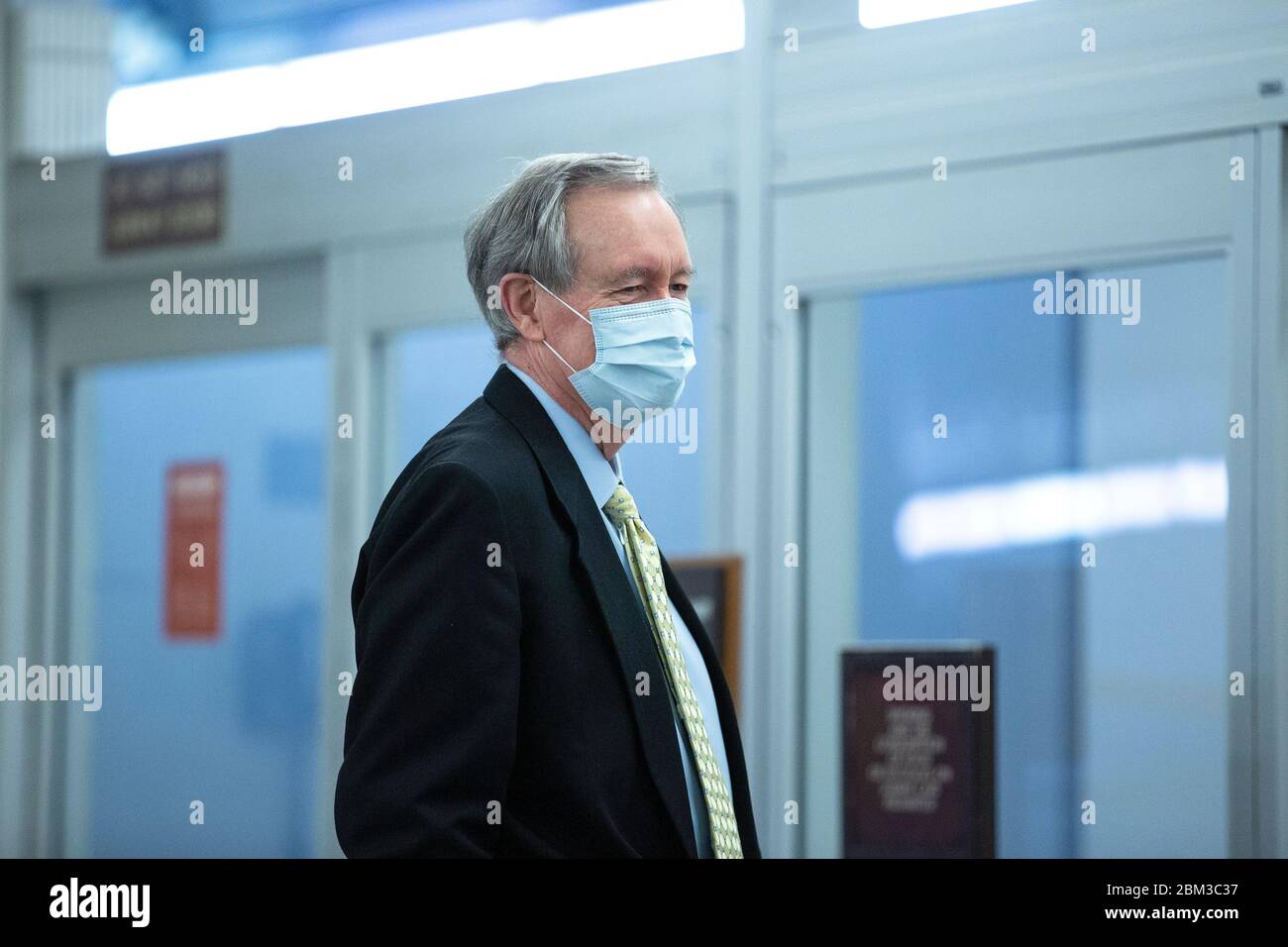 United States Senator Mike Crapo (Republican of Idaho) walks through ...