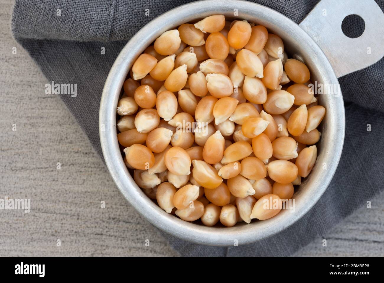 Popcorn Kernels in a Measuring Cup Stock Photo - Alamy