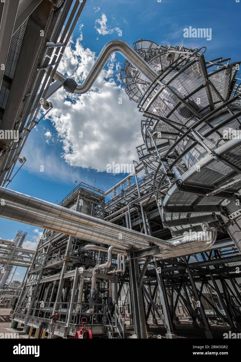 Natural gas processing plant structures with blue sky Stock Photo - Alamy