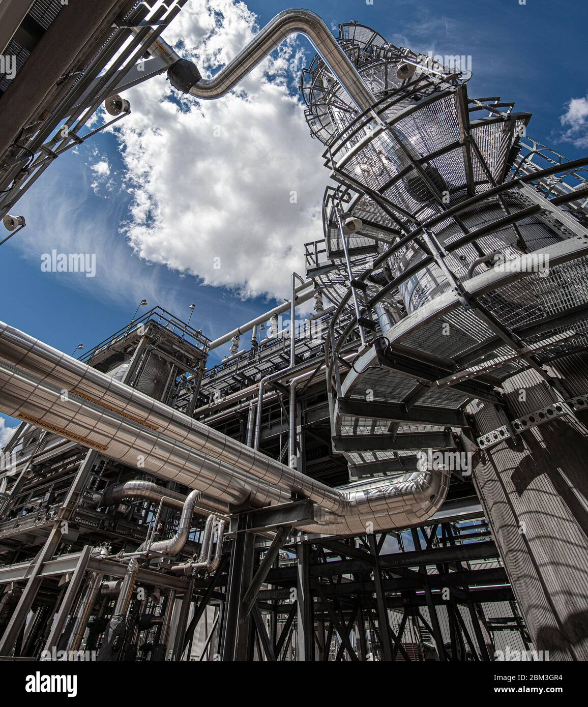 Natural gas processing plant structures with blue sky Stock Photo - Alamy