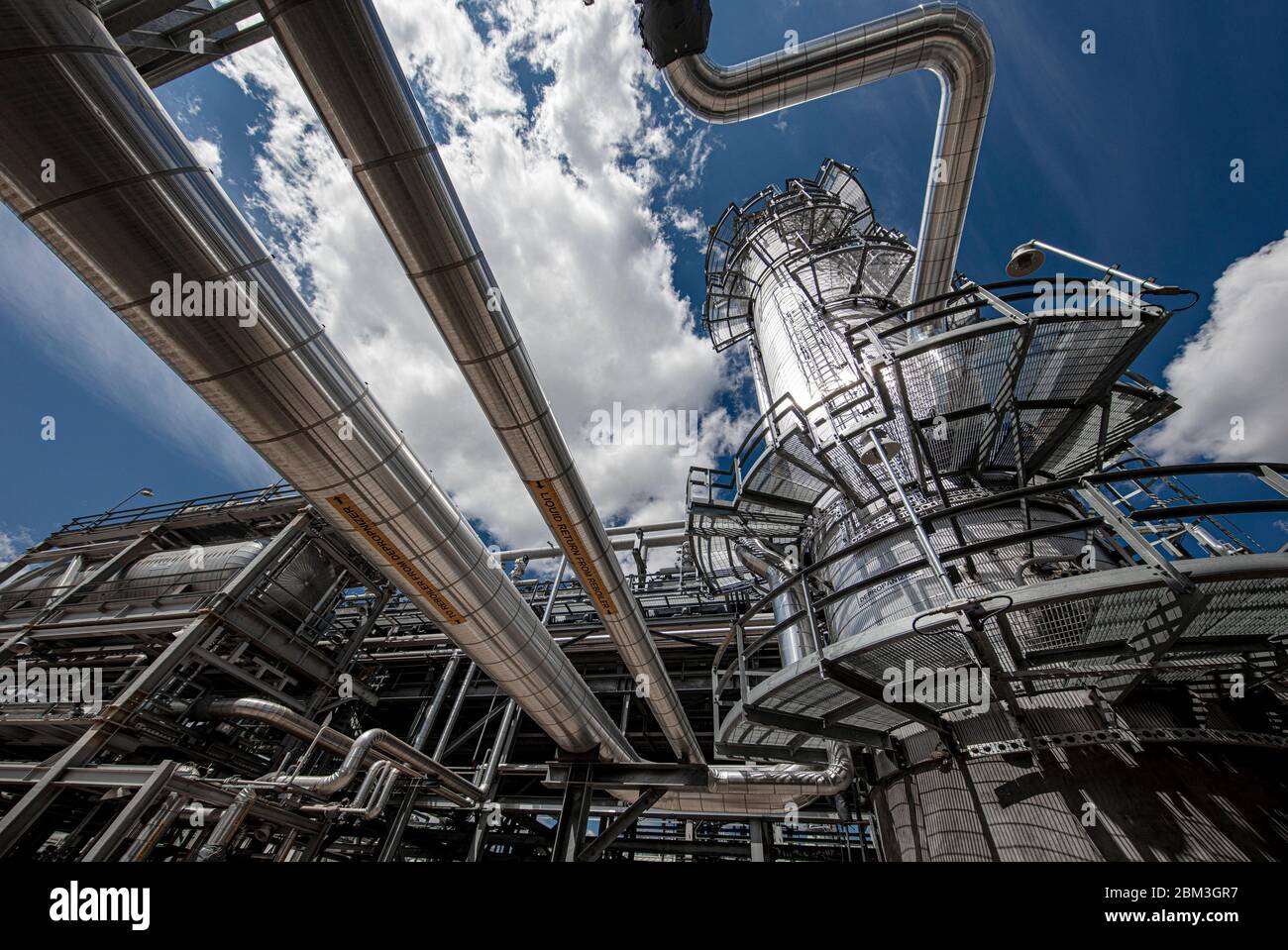 Natural gas processing plant structures with blue sky Stock Photo - Alamy