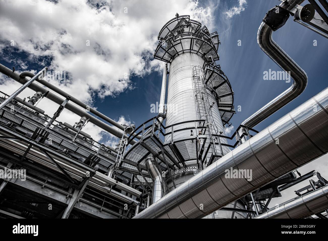 Natural gas plant structures against blue sky Stock Photo - Alamy
