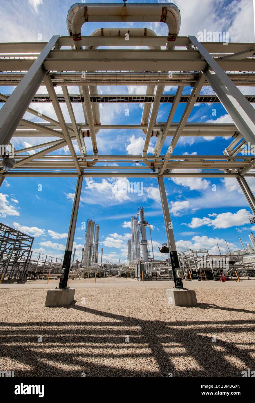 Natural gas plant structures against blue sky Stock Photo - Alamy