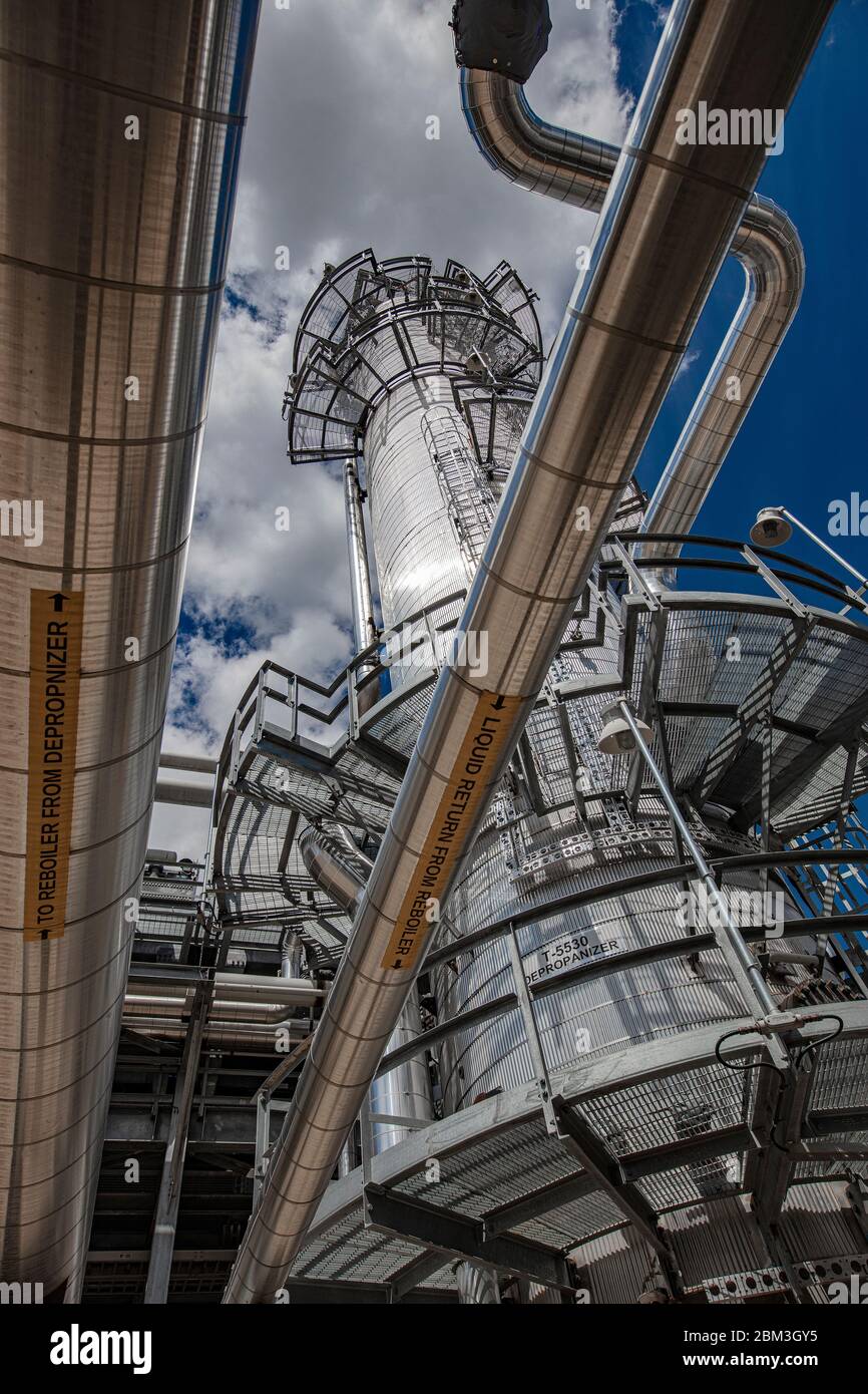 Natural gas plant structures against blue sky Stock Photo - Alamy