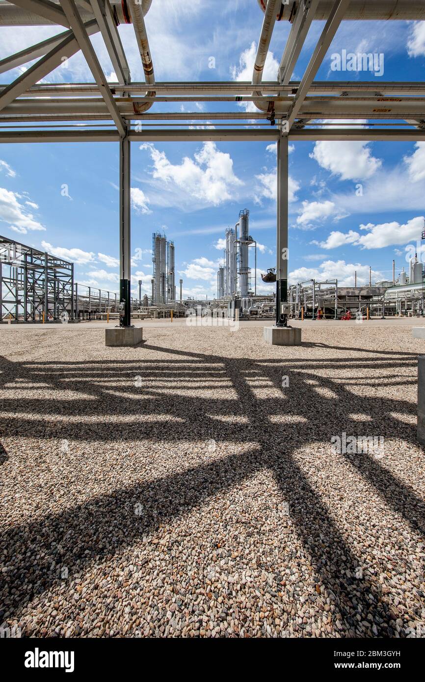Natural gas plant structures against blue sky Stock Photo - Alamy