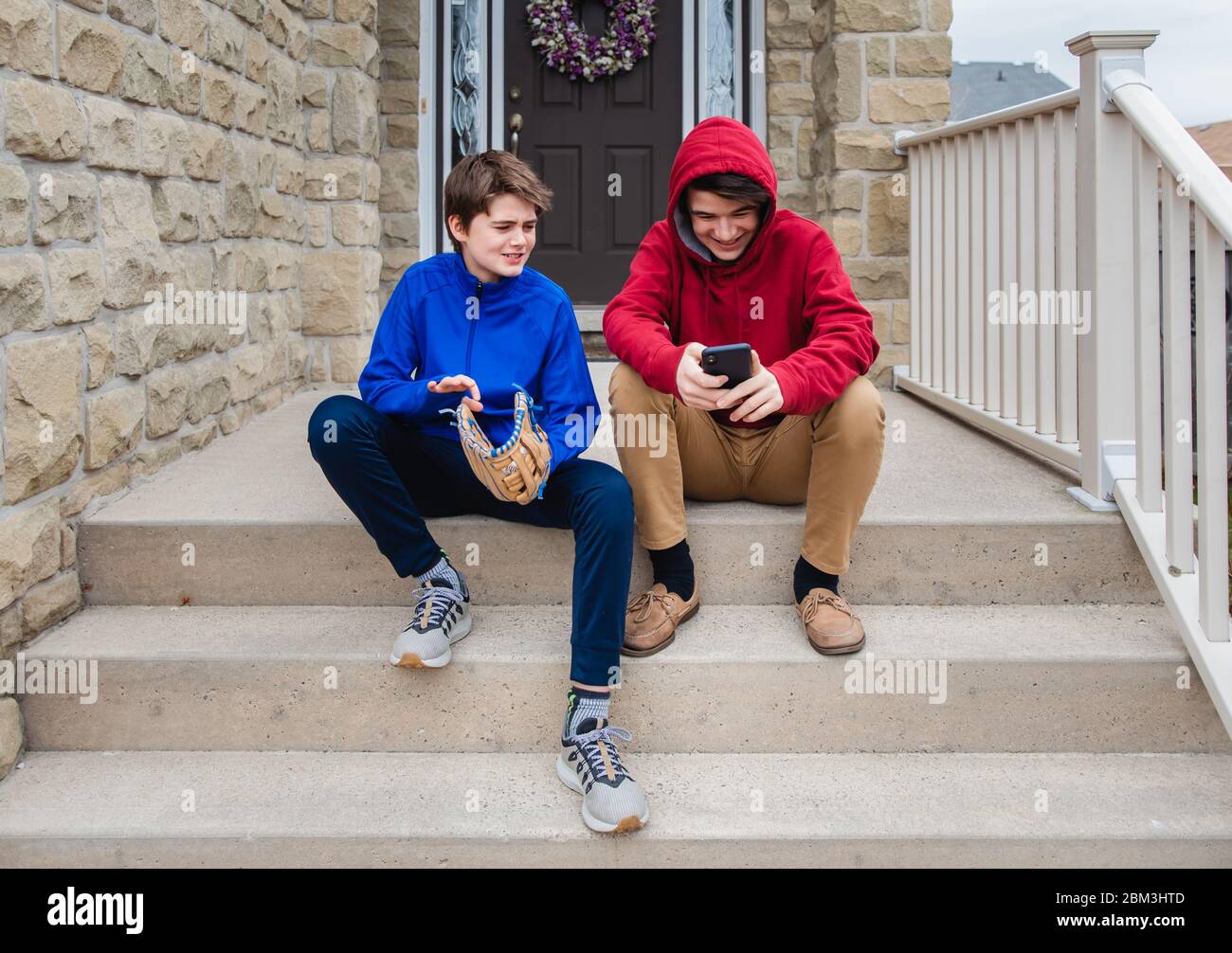 Boy talking phone baseball hi-res stock photography and images - Alamy